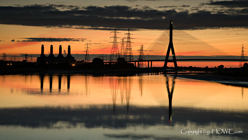 Photo of suspension bridge and reflection